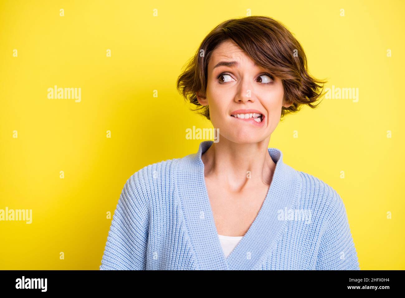 Photo of young girl afraid nervous worried bite lips teeth fail mistake ...