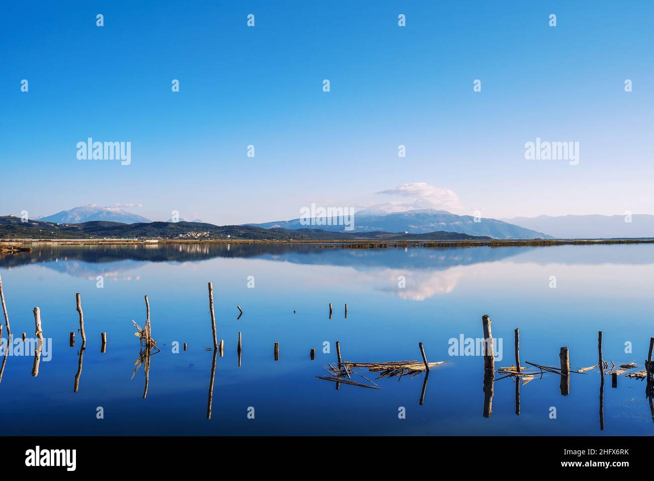 Wooden posts reflected in the lagoon of Narta, Vlore, Albania Stock ...