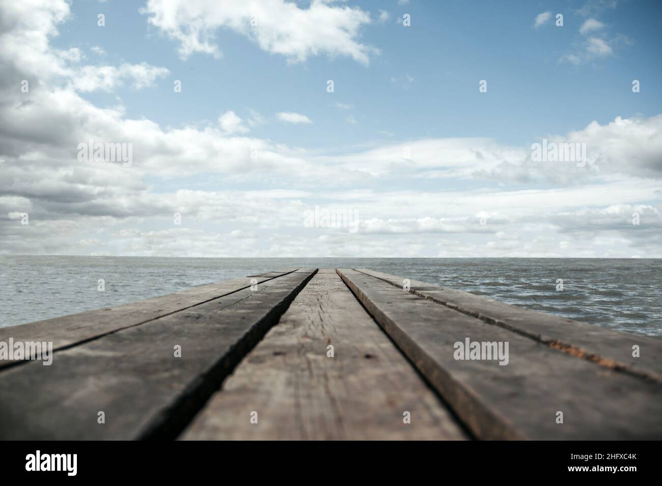 Beautiful wooden pier near the river bank Stock Photo - Alamy