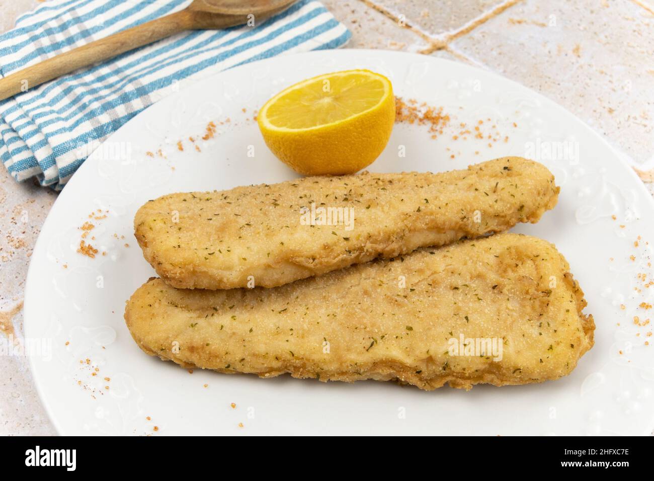 fillet meunière cooked in a plate with lemon Stock Photo - Alamy
