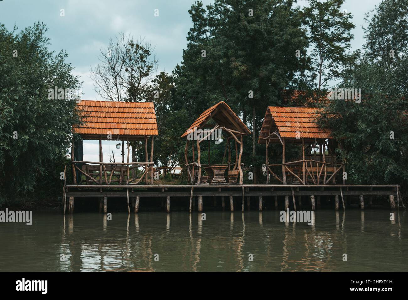 Beautiful pier by the river. Pier with seating area Stock Photo - Alamy