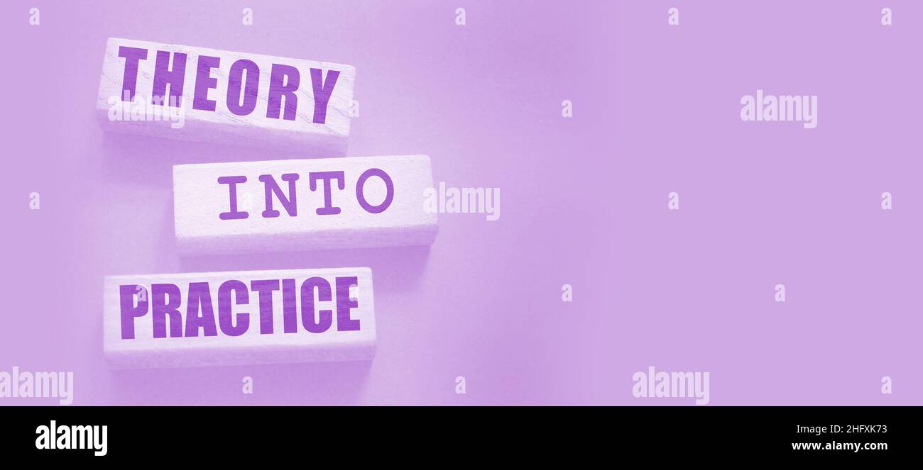 Theory into practice words written on wooden blocks. Education or ...
