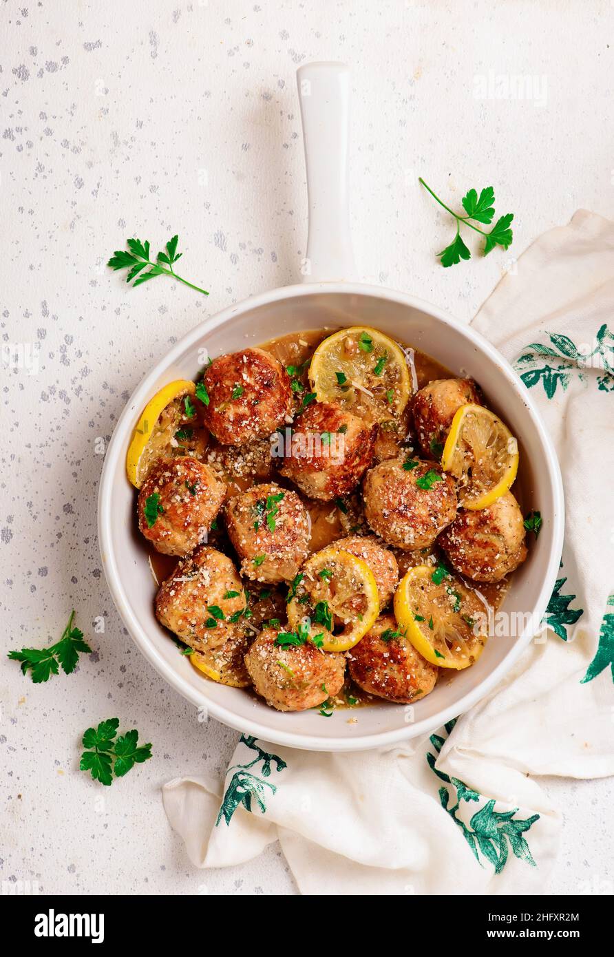 Chicken Romano Meatballs on the white skillet .selective focus.rustic ...