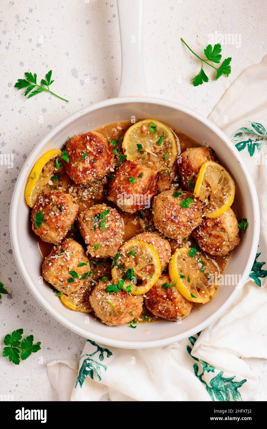 Chicken Romano Meatballs on the white skillet .selective focus.rustic ...