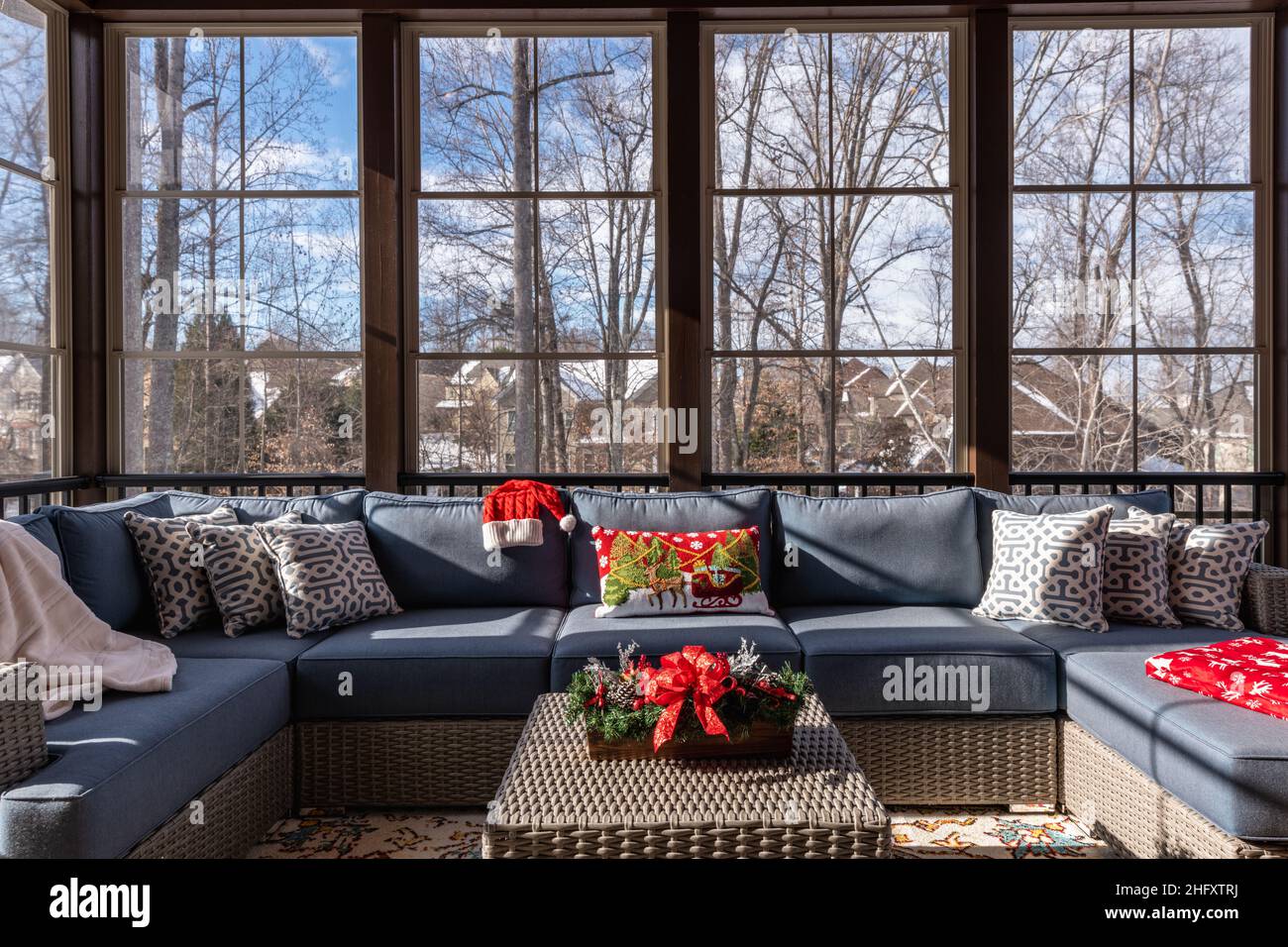 Cozy screened porch winter during Holidays season, snowy roofs and ...