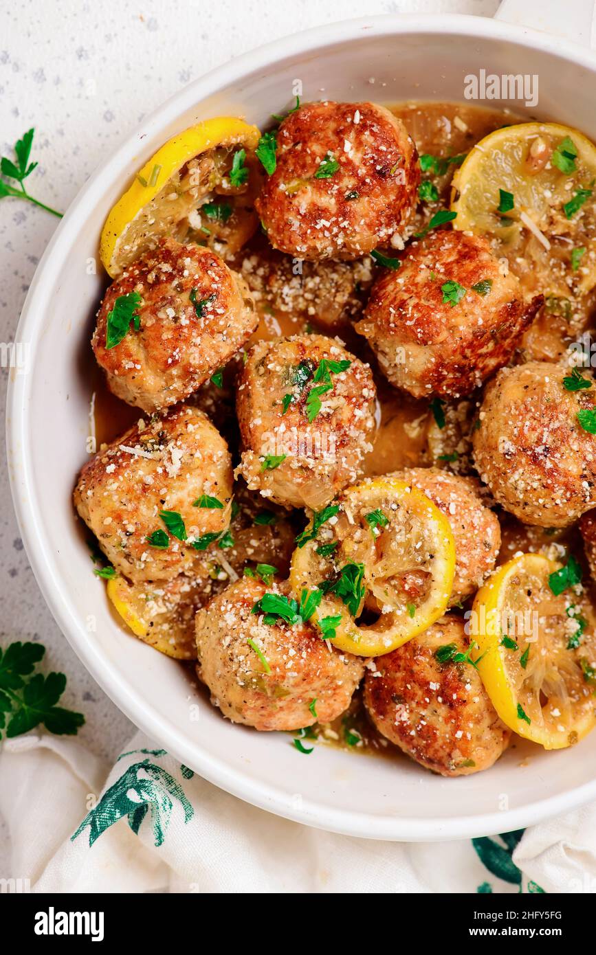 Chicken Romano Meatballs on the white skillet .selective focus.rustic ...