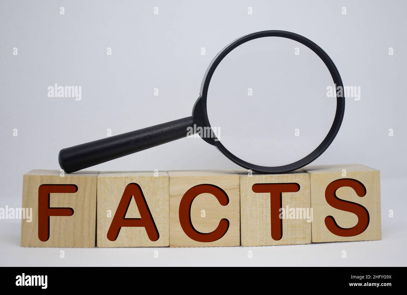 facts word written on wood blocks beige background Stock Photo - Alamy