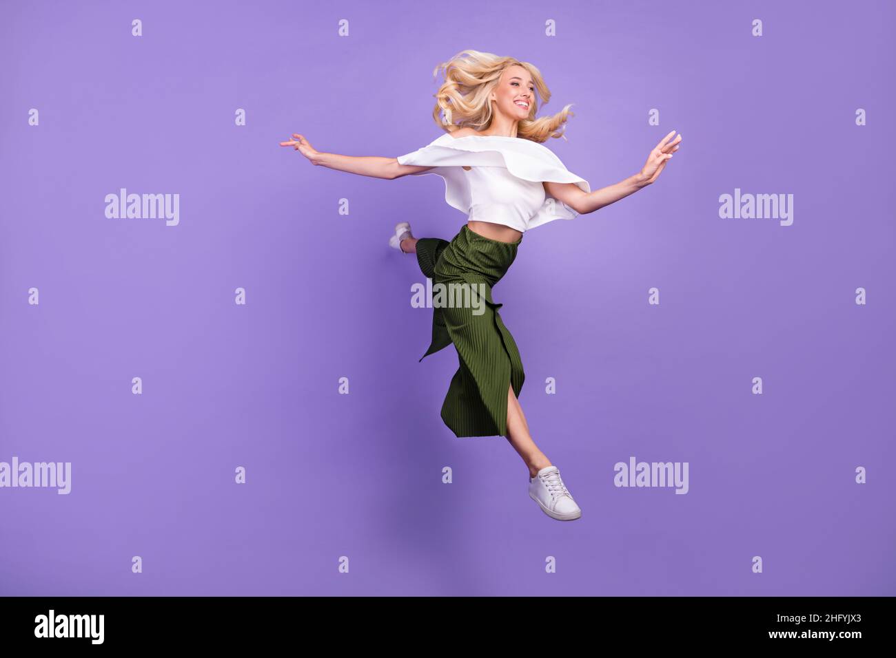 Full length body size photo blonde girl jumping up smiling doing ...