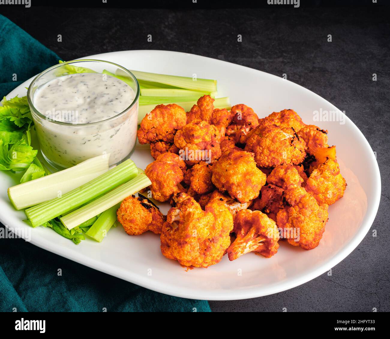 Buffalo Cauliflower Bites Served with Celery Sticks and Ranch Dressing ...