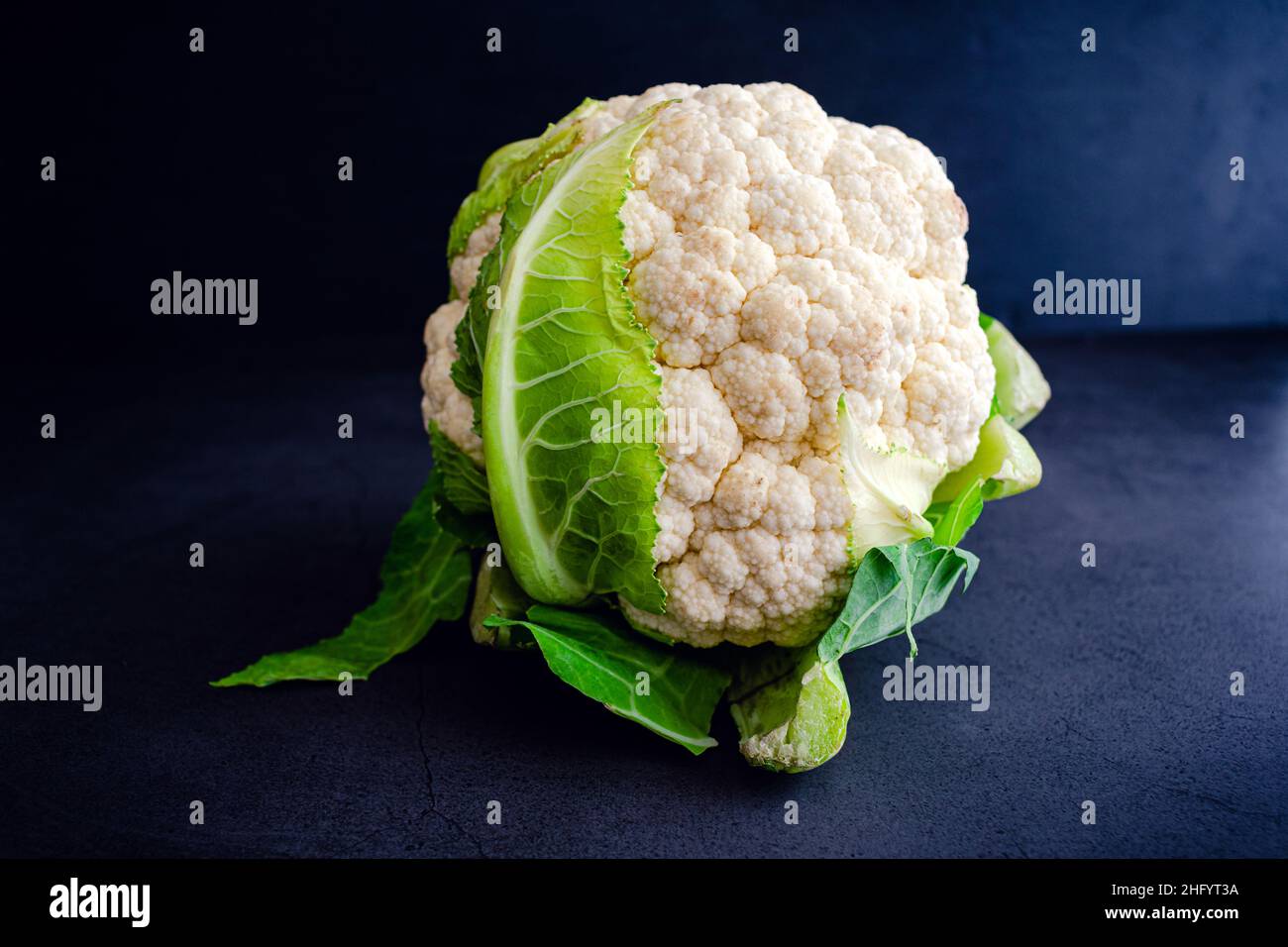 Whole Head of Cauliflower on a Dark Background: A whole head of ...