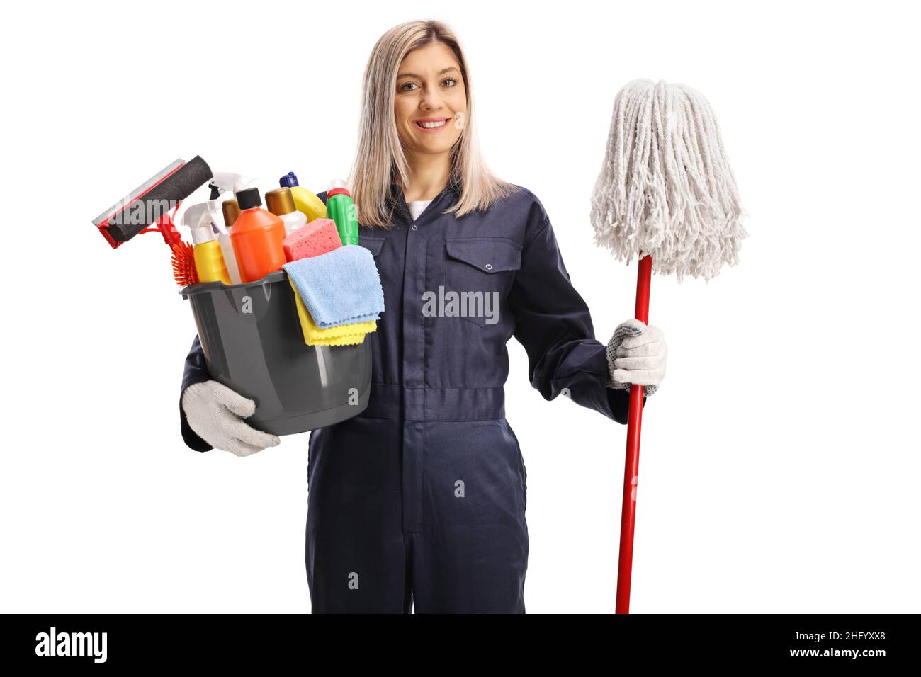 Professional female cleaner in a uniform holding a bucket of cleaning ...