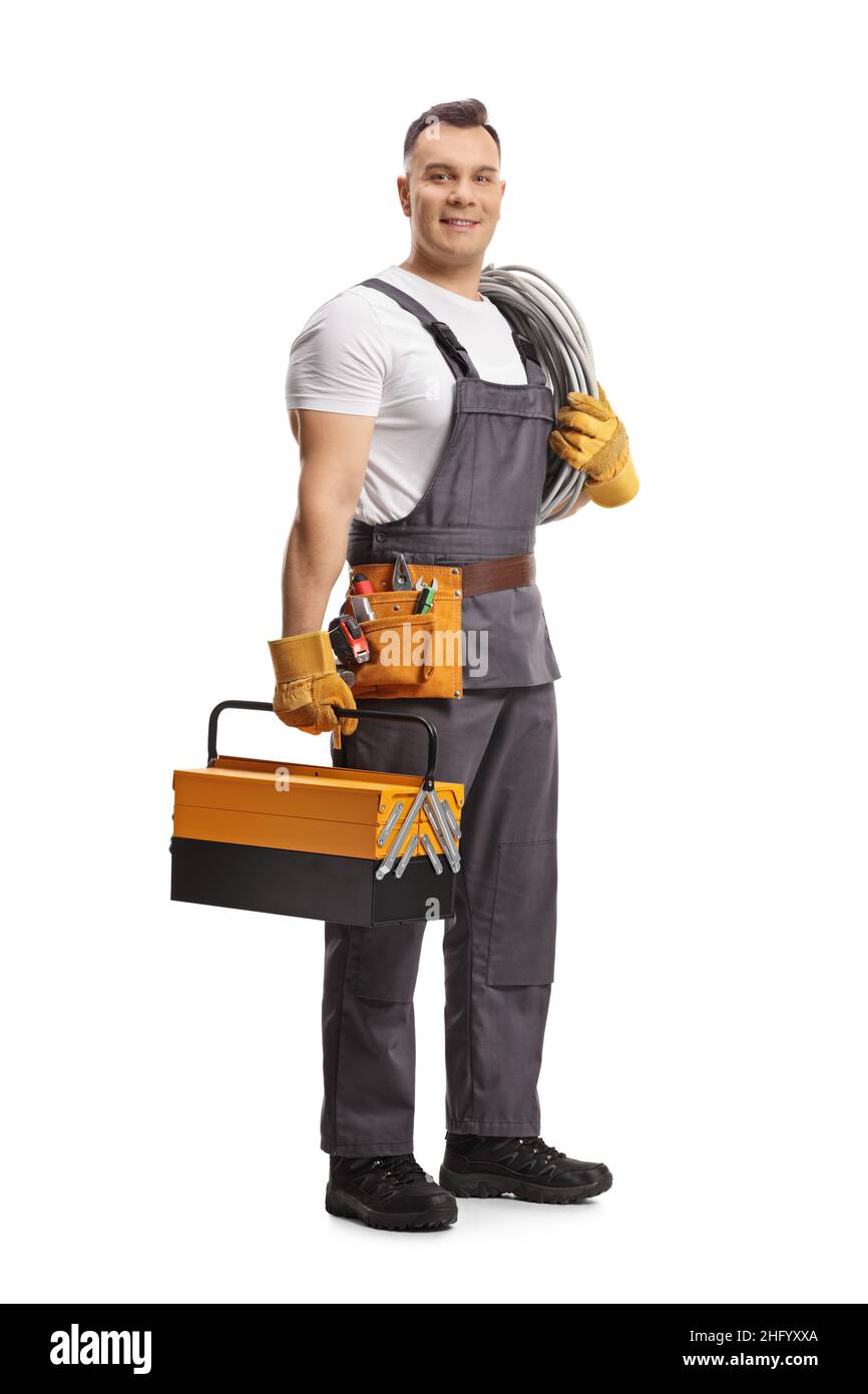 Electrician carrying cables on his shoulder and a tool box isolated on ...