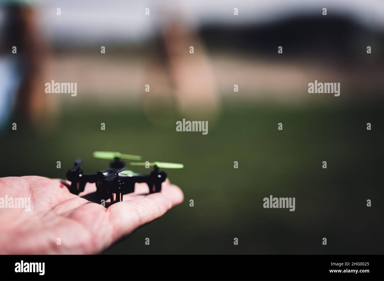 Miniature toy remote controlled drone taking off from a hand Stock ...