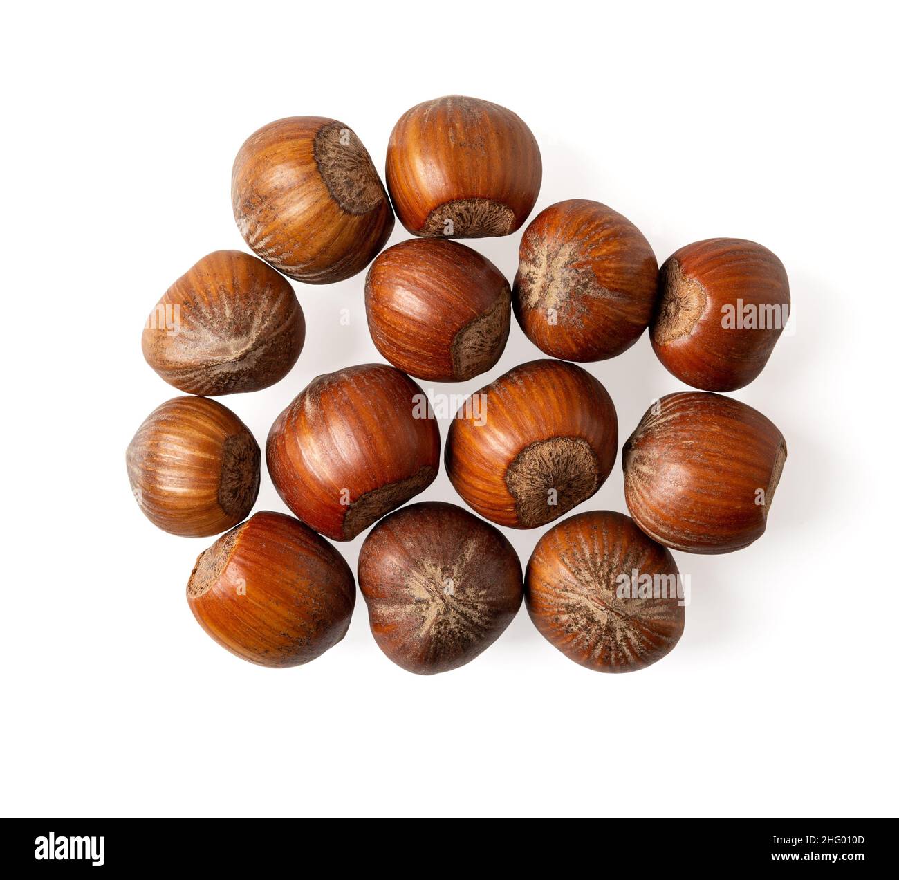Heap of unpeeled hazelnuts isolated on a white background. Whole ...