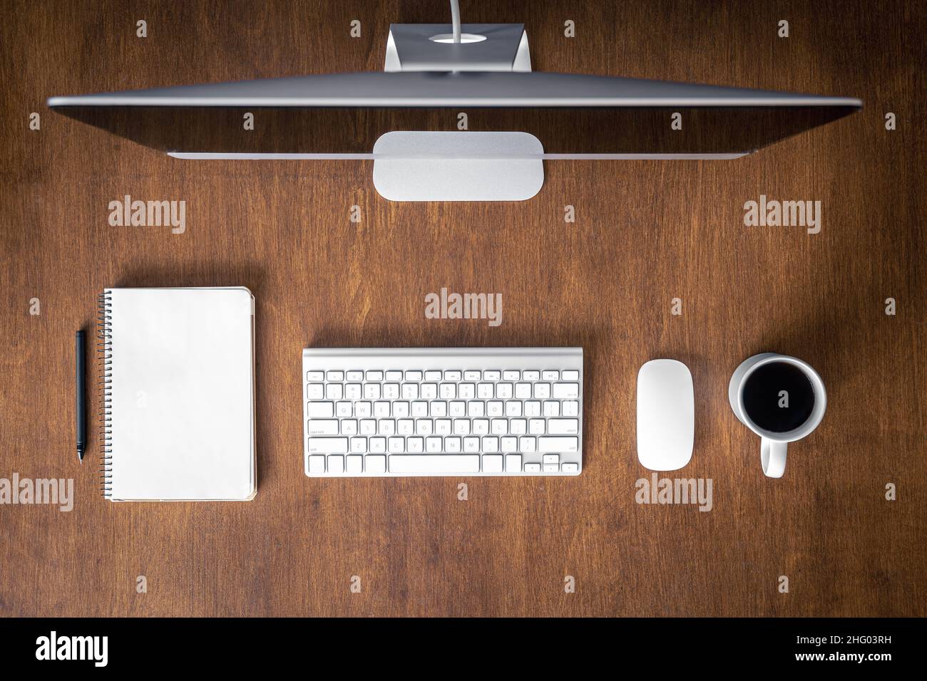 Top view, computer on a wooden table, work desk Stock Photo - Alamy