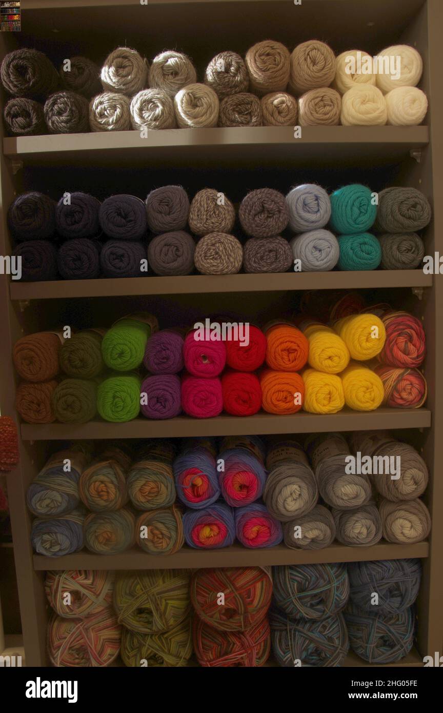 Colourful balls of wool on shelves Stock Photo - Alamy