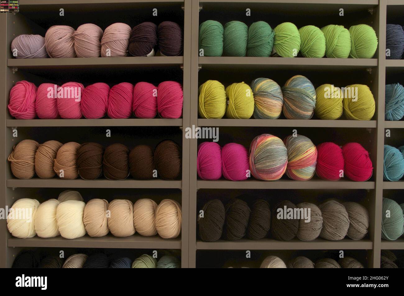 Colourful balls of wool on shelves Stock Photo - Alamy