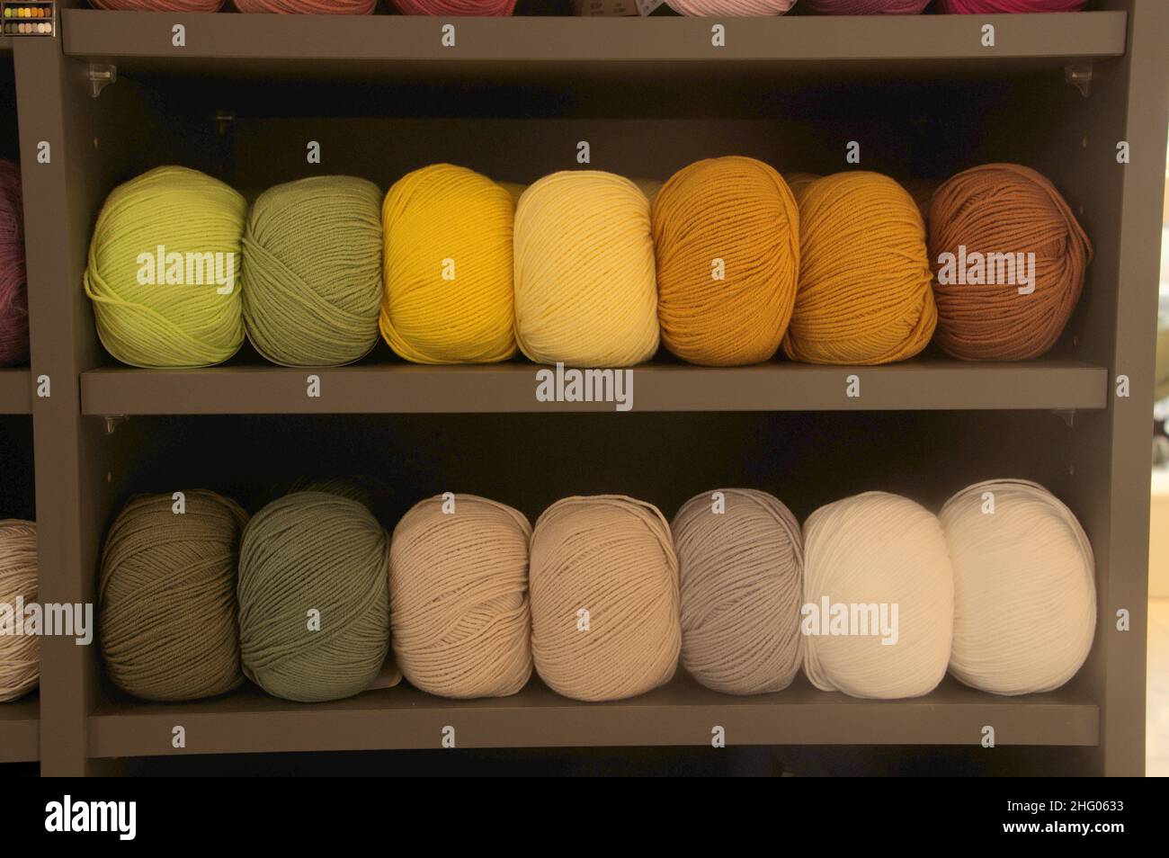 Colourful balls of wool on shelves Stock Photo - Alamy