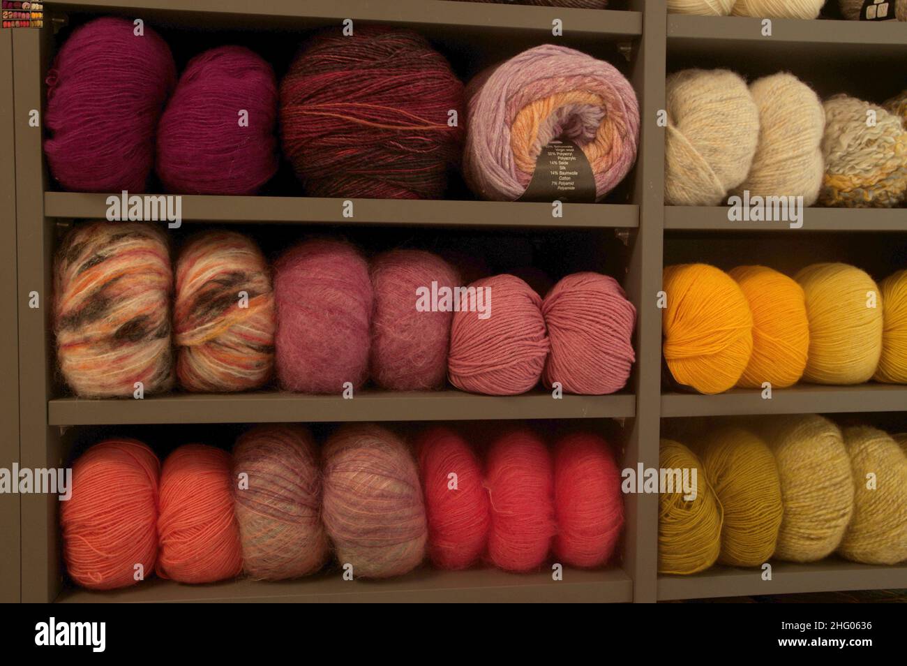 Colourful balls of wool on shelves Stock Photo - Alamy