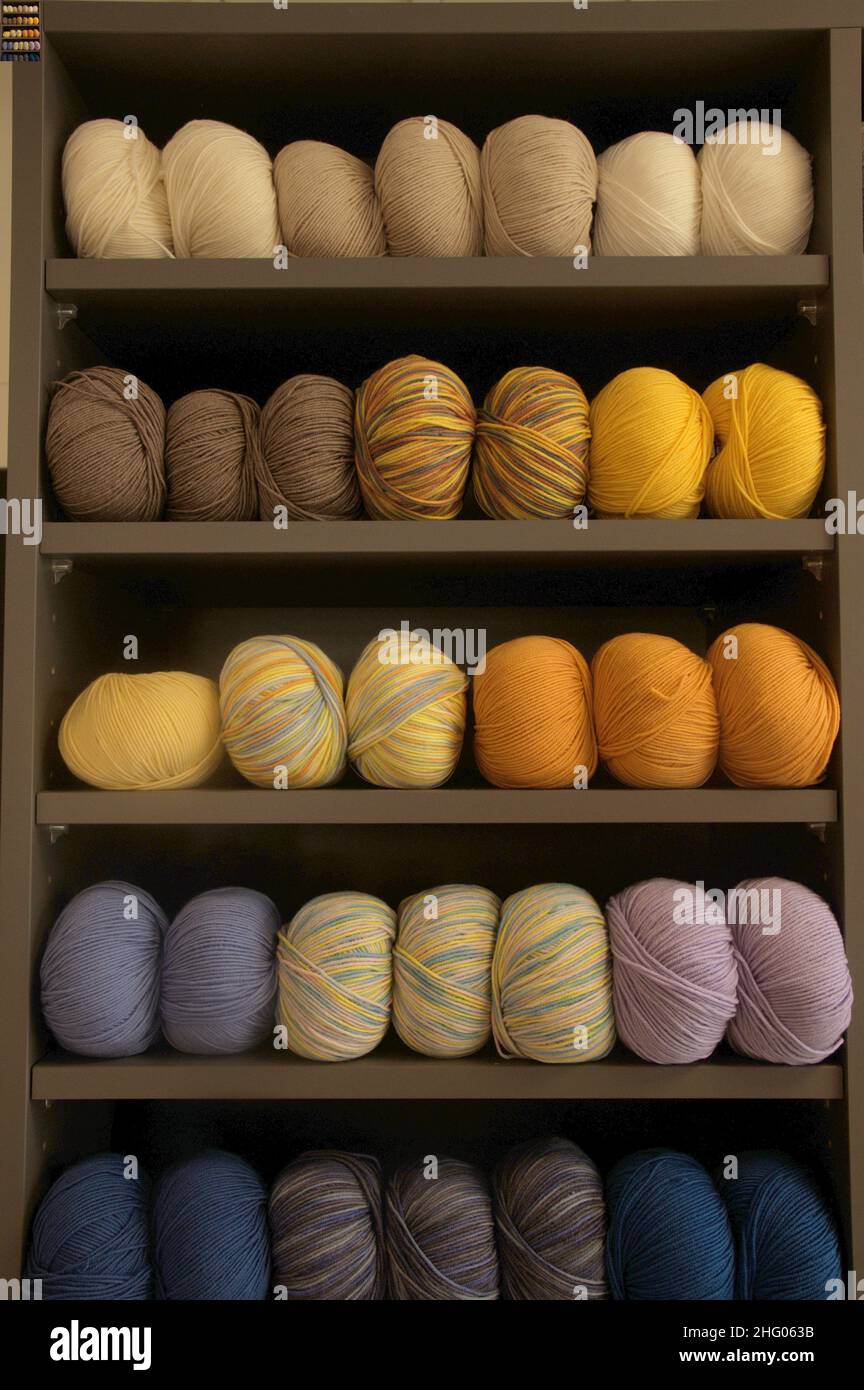 Colourful balls of wool on shelves Stock Photo - Alamy