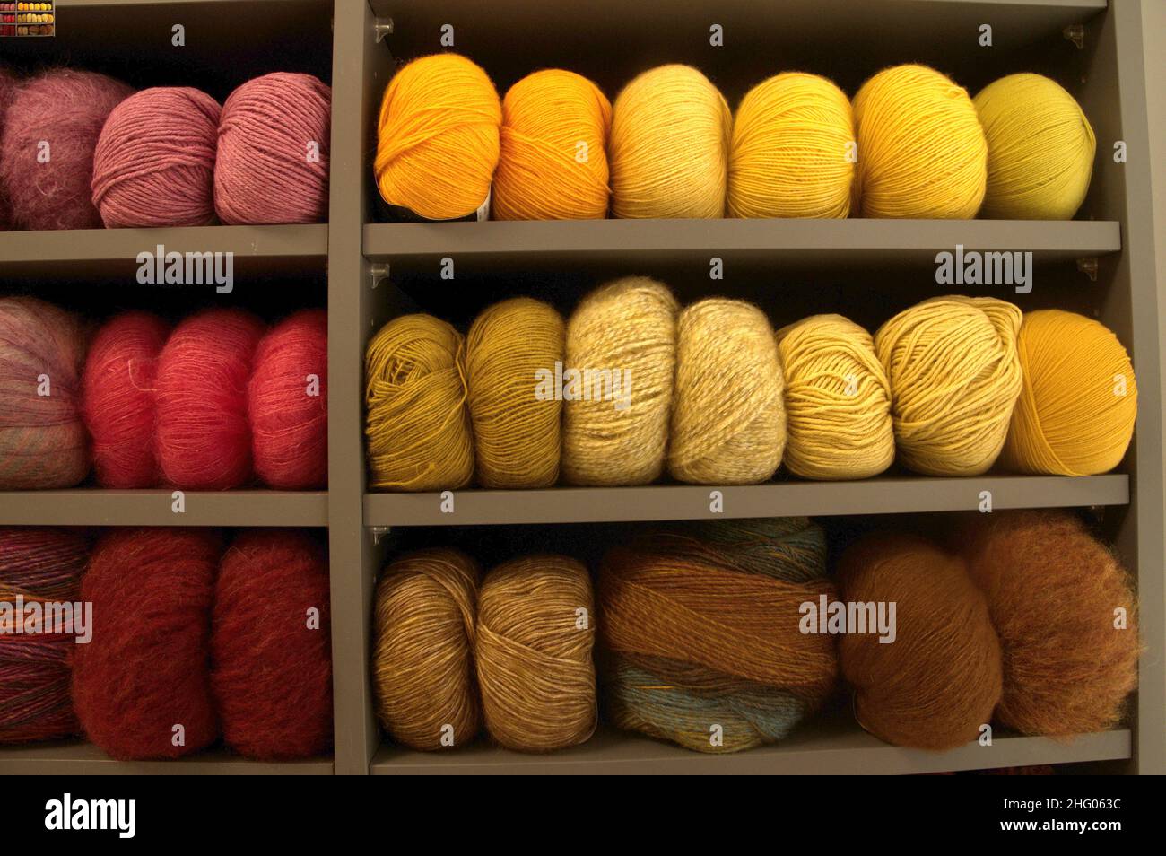 Colourful balls of wool on shelves Stock Photo - Alamy