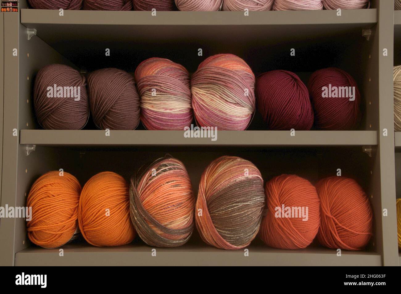 Colourful balls of wool on shelves Stock Photo - Alamy