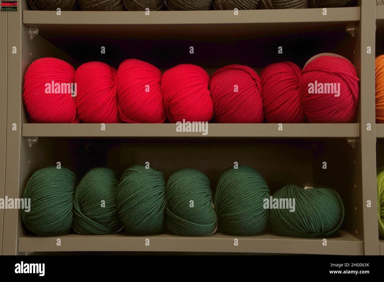 Colourful balls of wool on shelves Stock Photo - Alamy