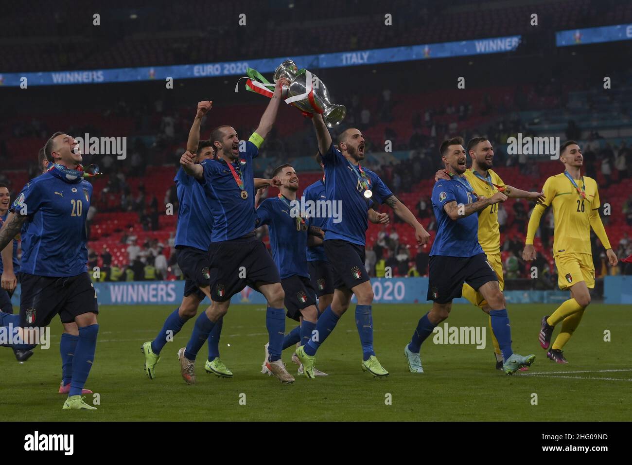 Italian players celebrate with the trophy after the Euro 2020 soccer ...