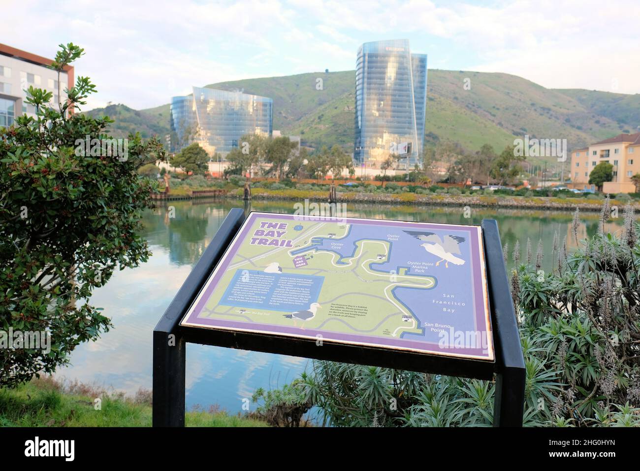 The Bay Trail map and information guide at Oyster Point with high rise ...