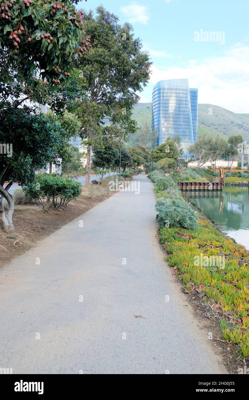 Paved section of The Bay Trail at Oyster Point with high rise ...