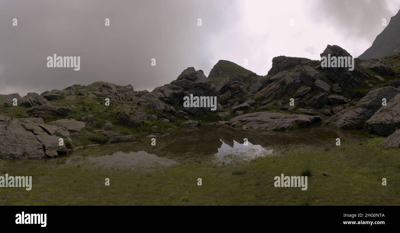 Pool and surrounding rocks on the Pizol, Swiss Alps Stock Photo - Alamy
