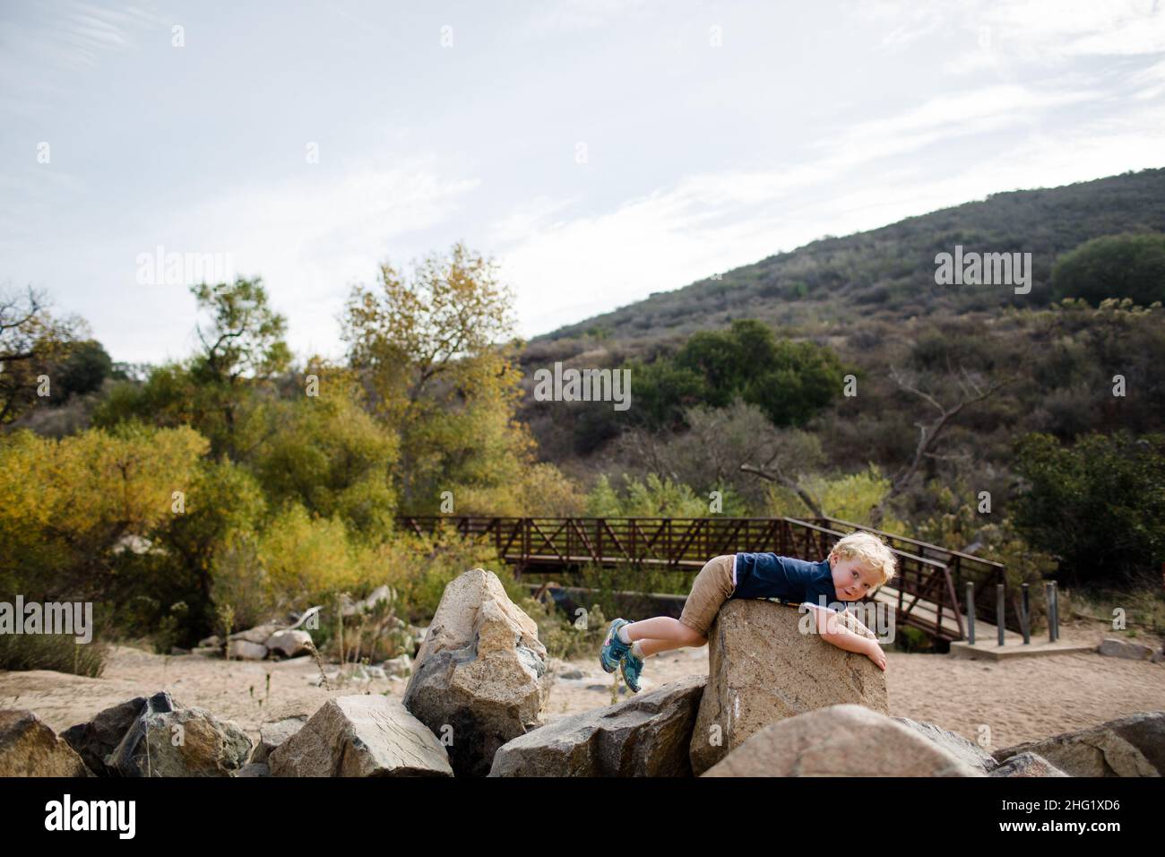 Boy laying rocks hi-res stock photography and images - Alamy