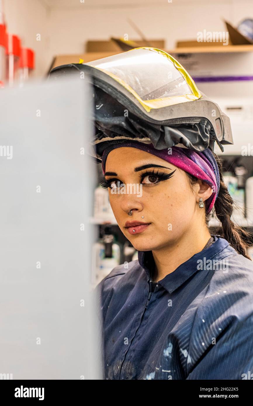 Female Auto worker prepping paint Stock Photo - Alamy