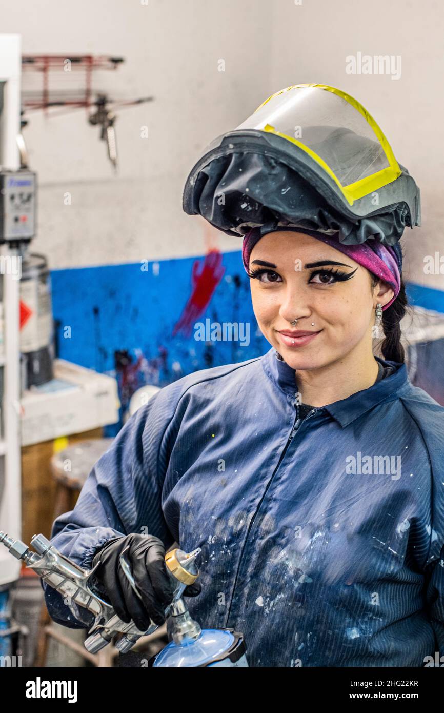 Female Auto worker prepping paint Stock Photo - Alamy