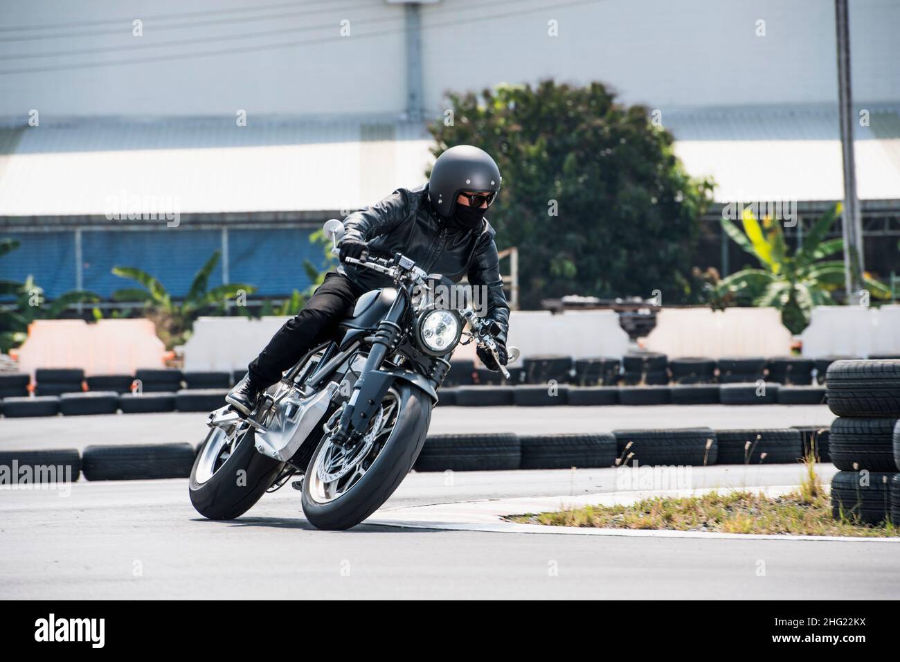 man rides his electric motorcycle on race track in Bangkok Stock Photo ...