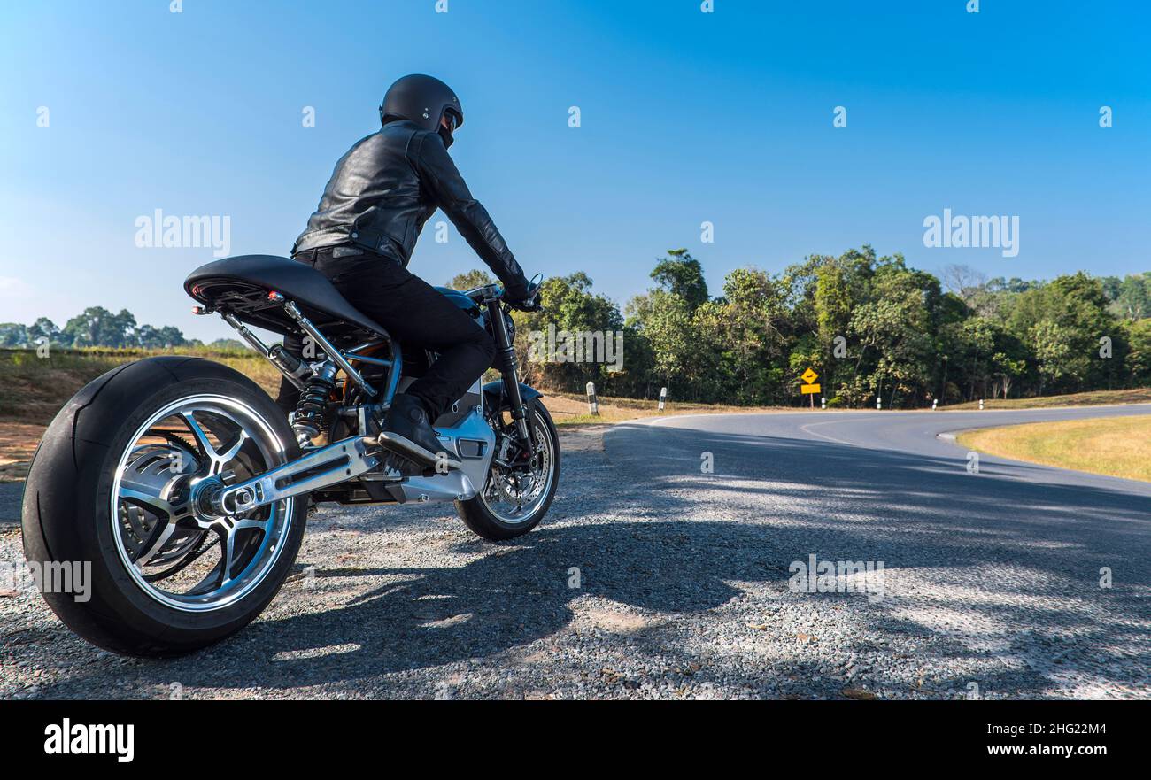man riding an electric motorcycle in Thailand Stock Photo - Alamy