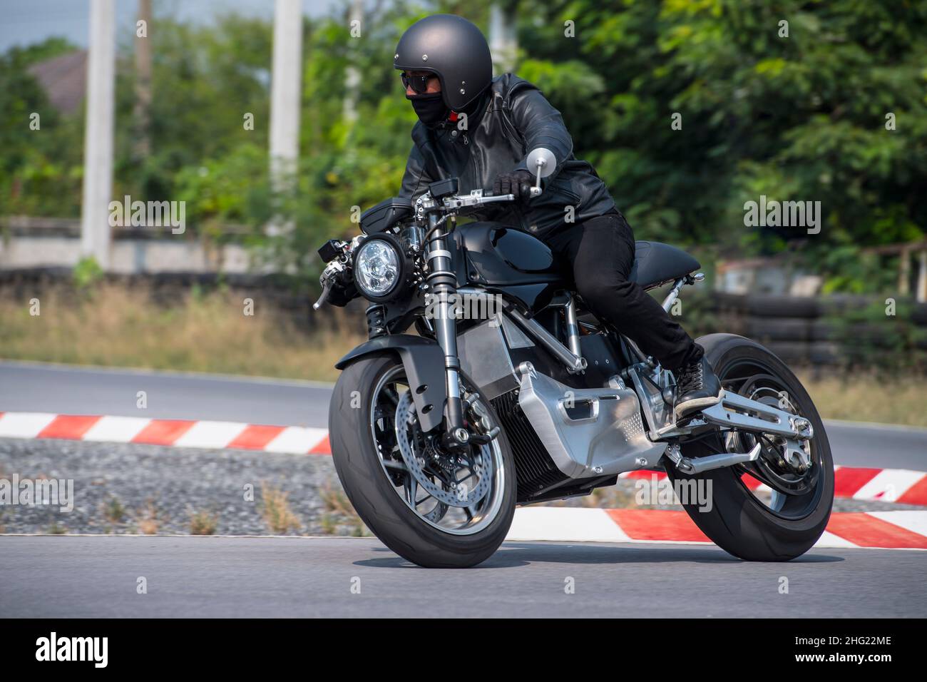 man rides his electric motorcycle on race track in Bangkok Stock Photo ...