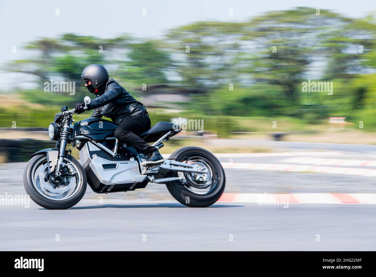 man rides his electric motorcycle on race track in Bangkok Stock Photo ...