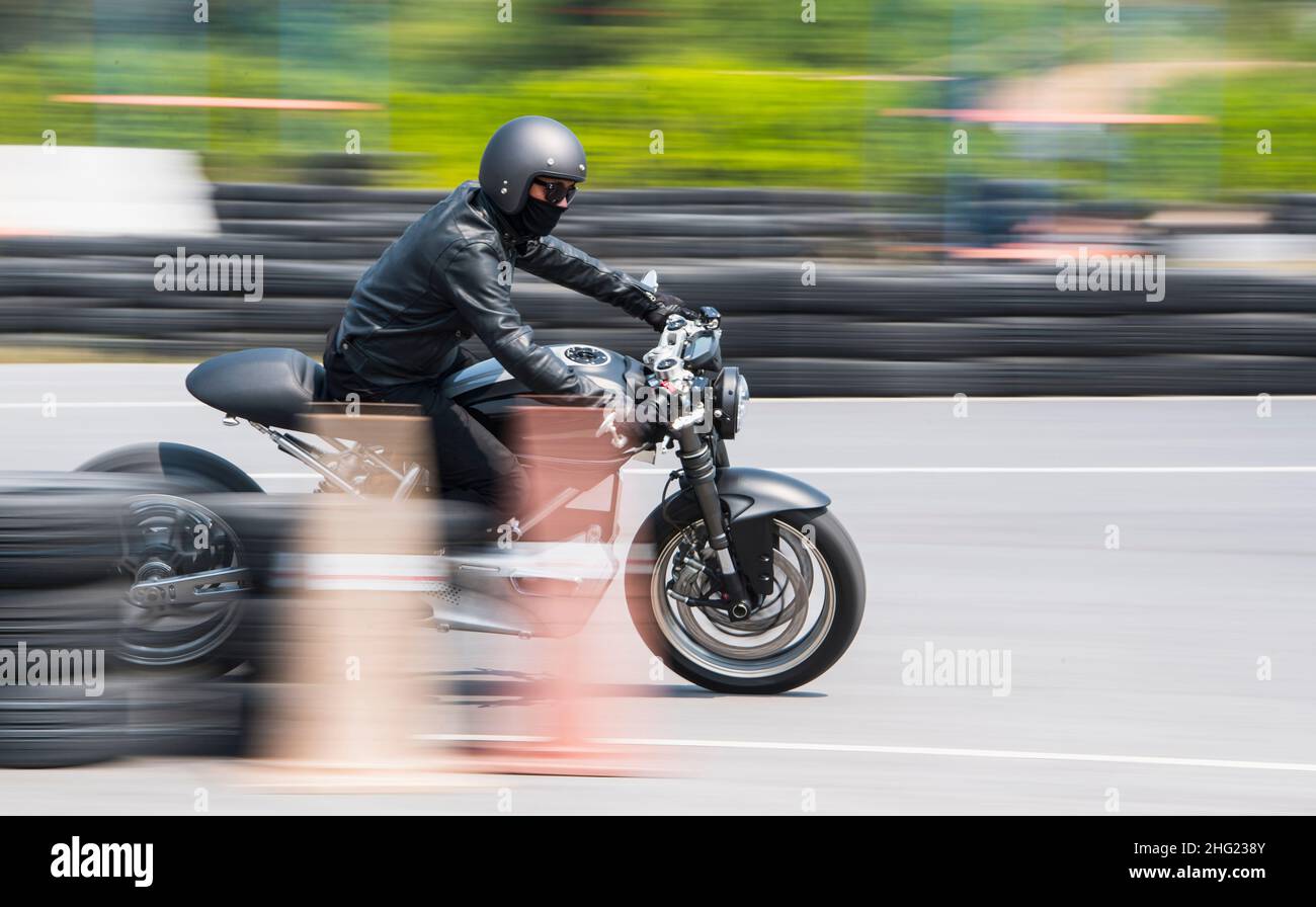 man rides his electric motorcycle on race track in Bangkok Stock Photo ...