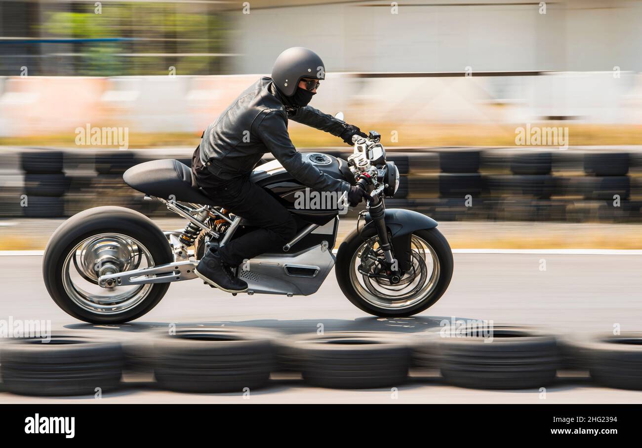man rides his electric motorcycle on race track in Bangkok Stock Photo ...
