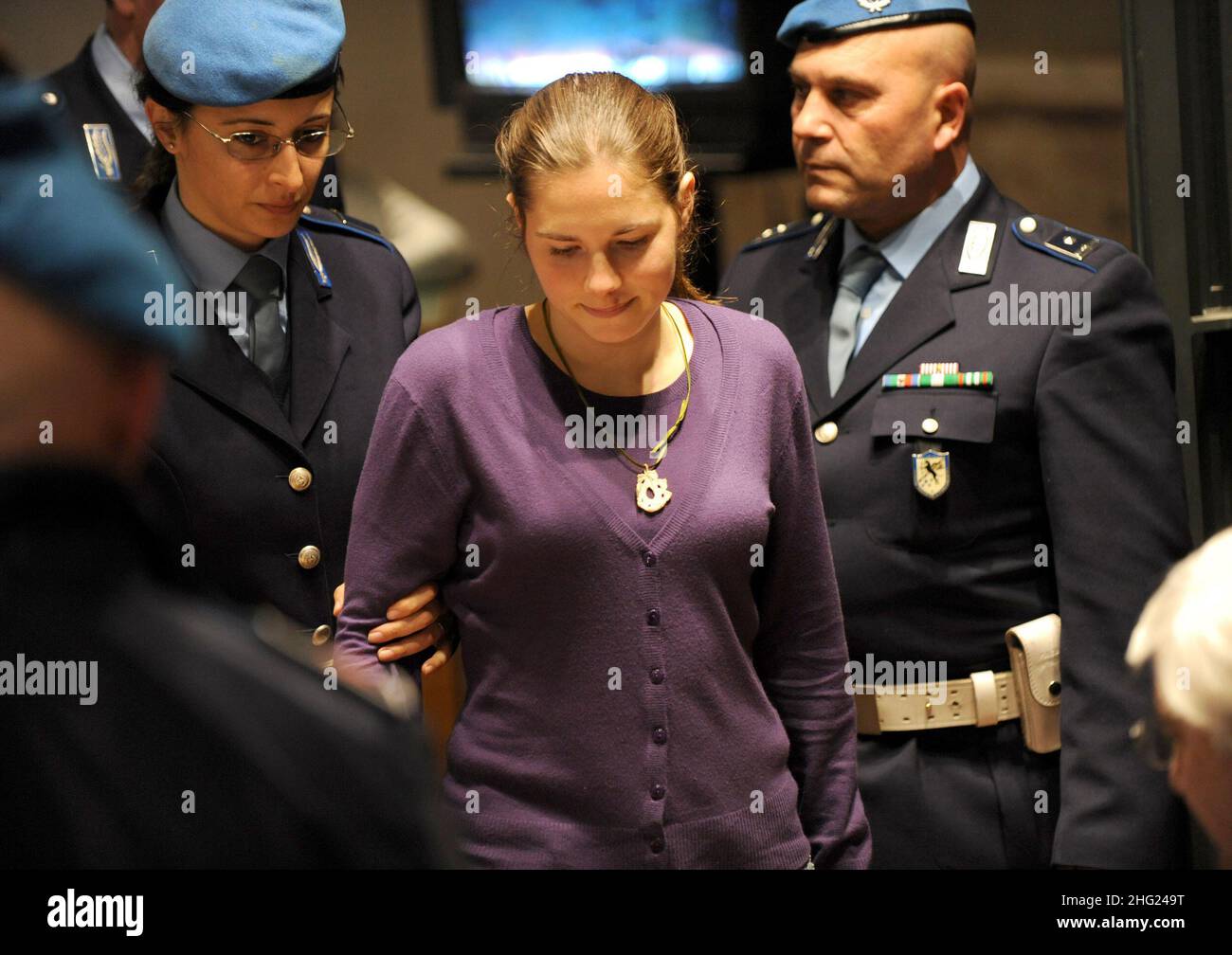 Amanda Knox, centre, escorted by a Penitentiary guard arrives at ...