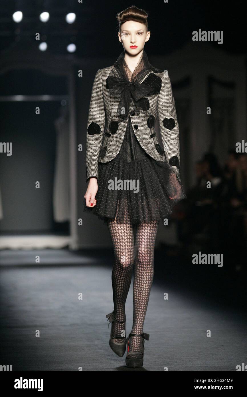 A model on the cat walk wears a design by Moschino during Milan Fashion ...