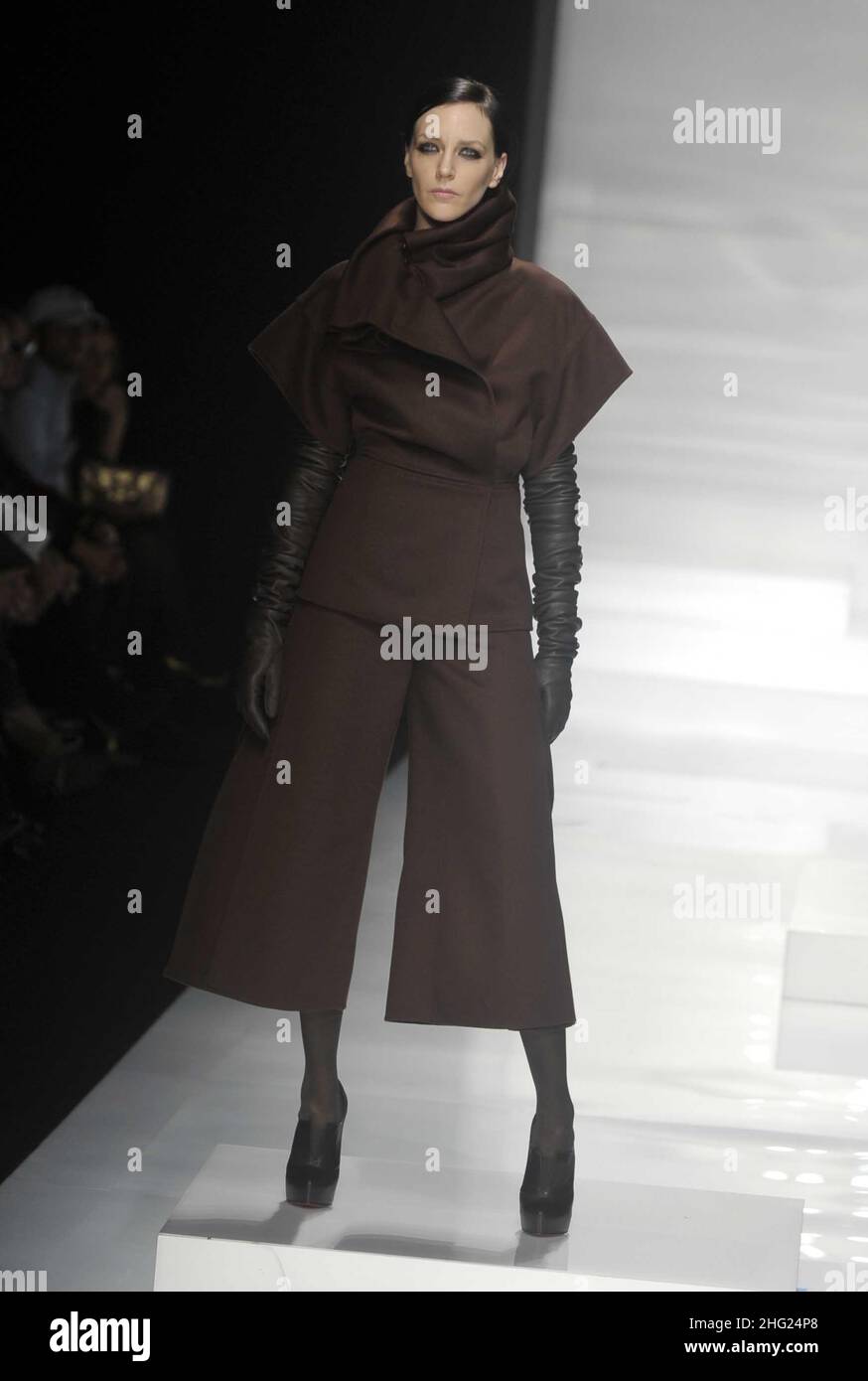 A model on the cat walk wears a design by Brioni during Milan Fashion ...