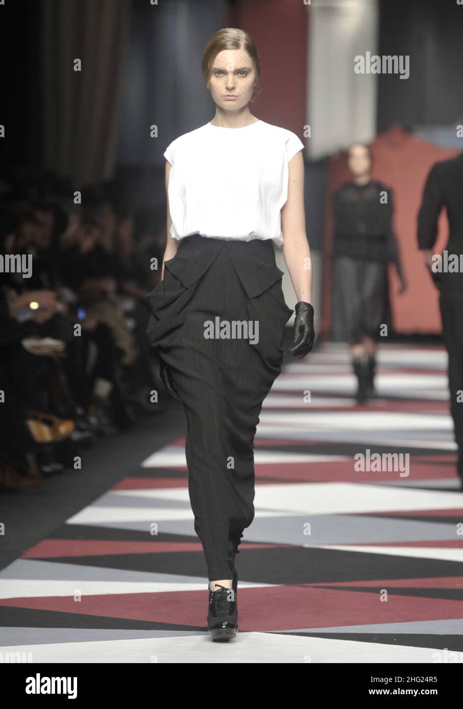 A model on the cat walk wears a design by Antonio Marras during Milan ...