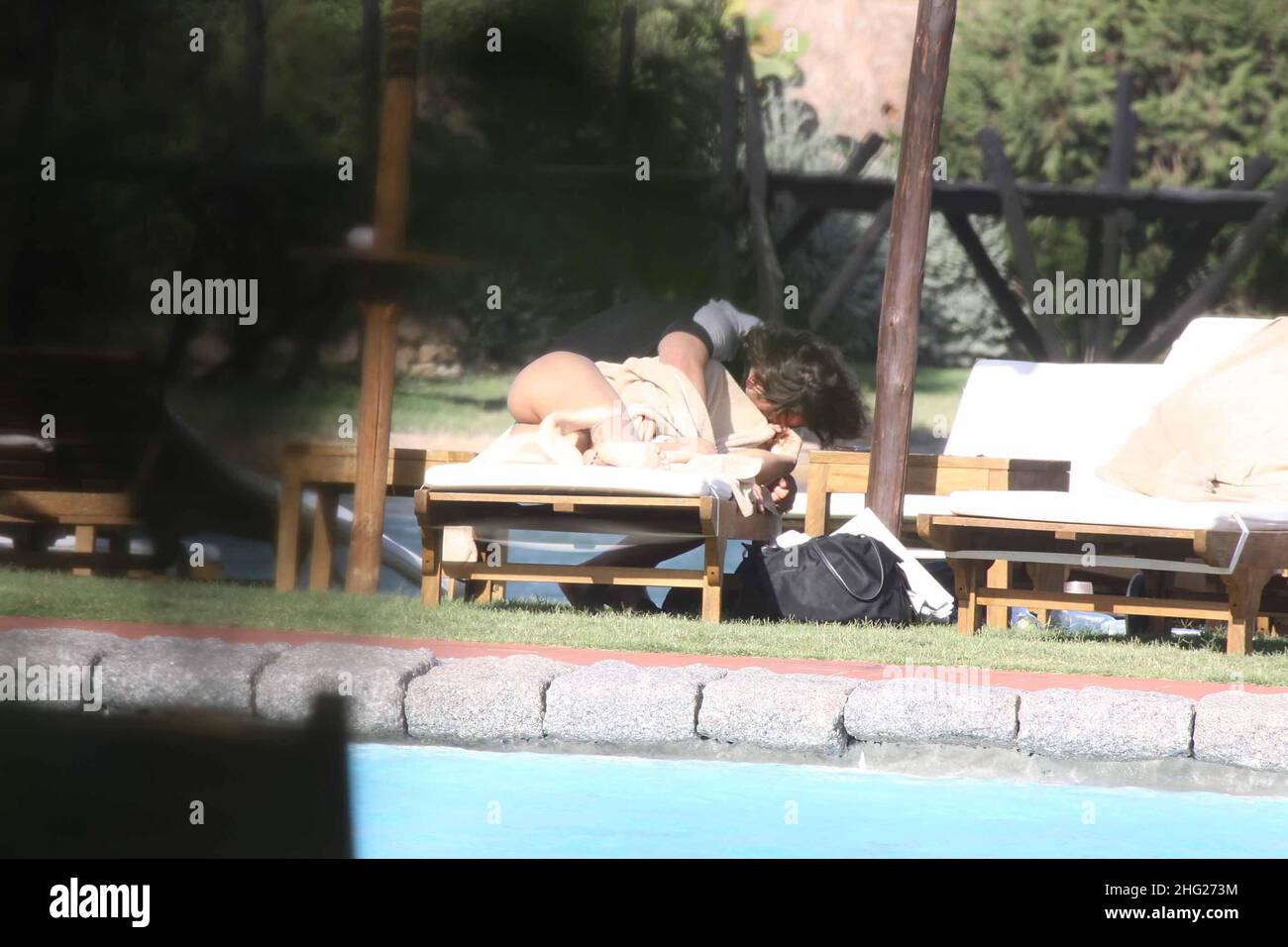 Argentinian singer and actress Lola Ponce relaxes by the pool while on ...