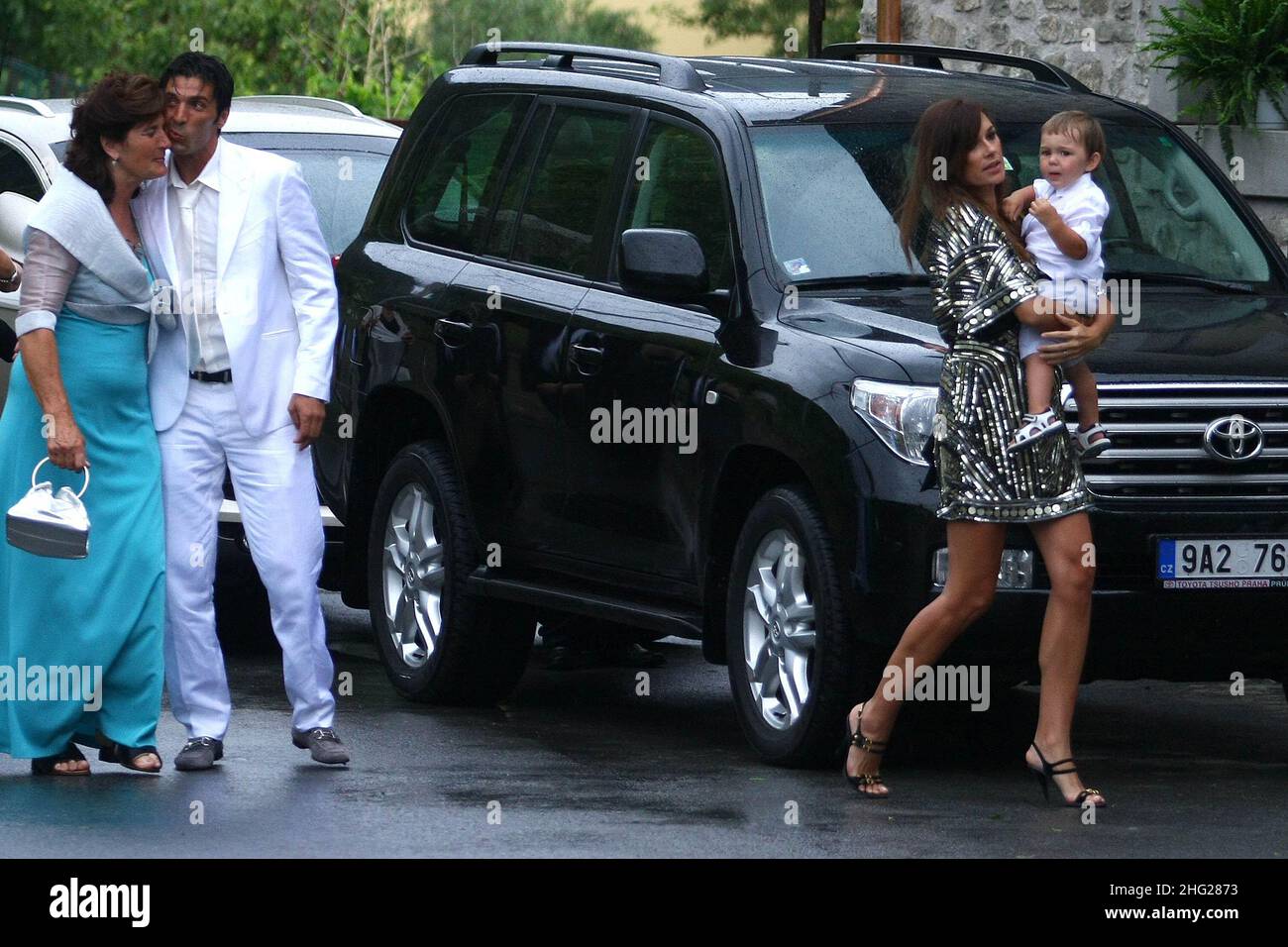 Italian footballer Gigi Buffon and his family attending the wedding of ...