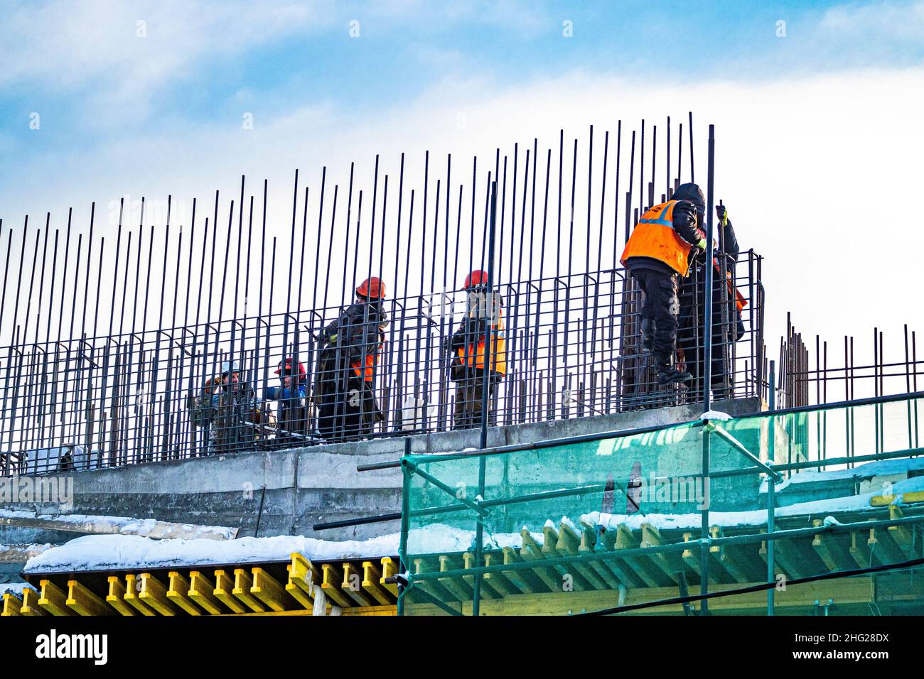 Russia, Moscow. Workers at the construction site of residential complex ...
