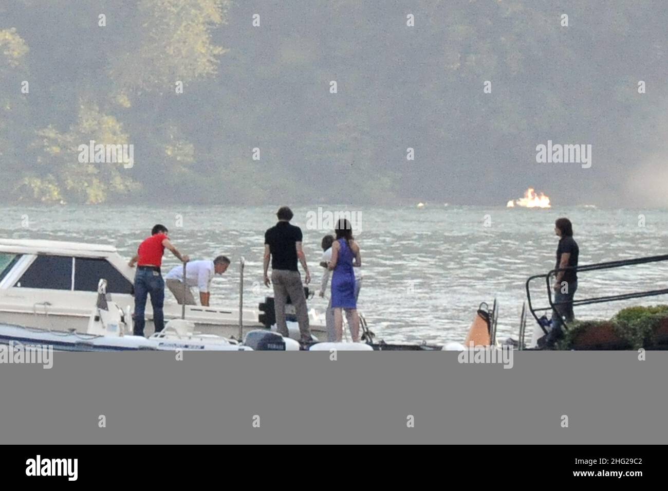 George Clooney is seen on a boat with friends returning to his villa on ...