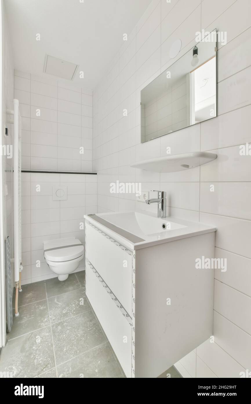 Interior of small clean restroom in miniature style Stock Photo - Alamy