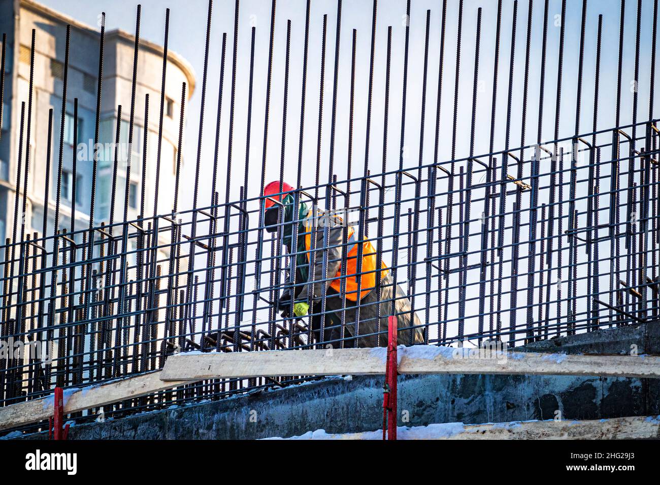 Russia, Moscow. Workers at the construction site of residential complex ...